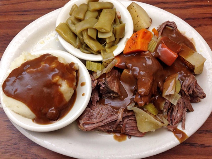 Pot roast so tender it practically surrenders at the sight of your fork, swimming in gravy rich enough to have its own tax bracket.