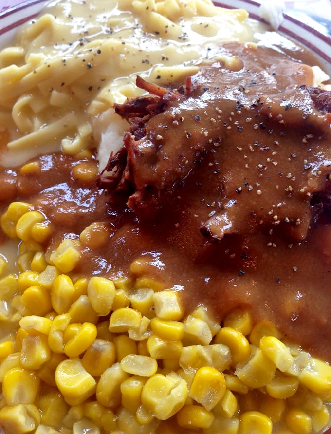 Pot roast so tender it surrenders at the sight of your fork, alongside classic country sides.