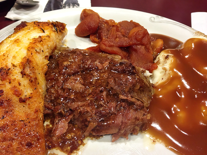 Pot roast so tender it surrenders at the mere sight of your fork, accompanied by sides that would make any grandmother nod in approval.