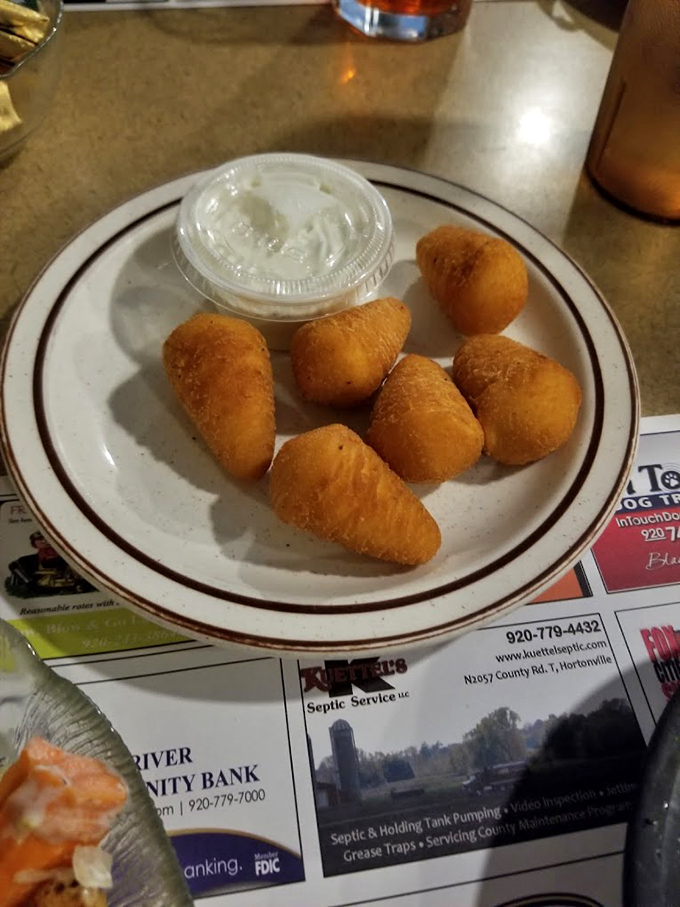 Golden potato puffs with a side of dipping sauce&mdash;like sophisticated tater tots that went to culinary school and came back with a degree.