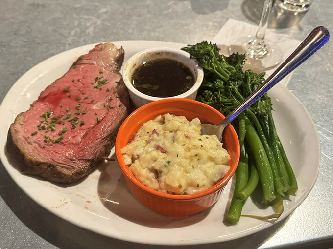 Prime rib cooked to rosy perfection, accompanied by creamy mac and cheese and vibrant vegetables&mdash;a plate of pure contentment.