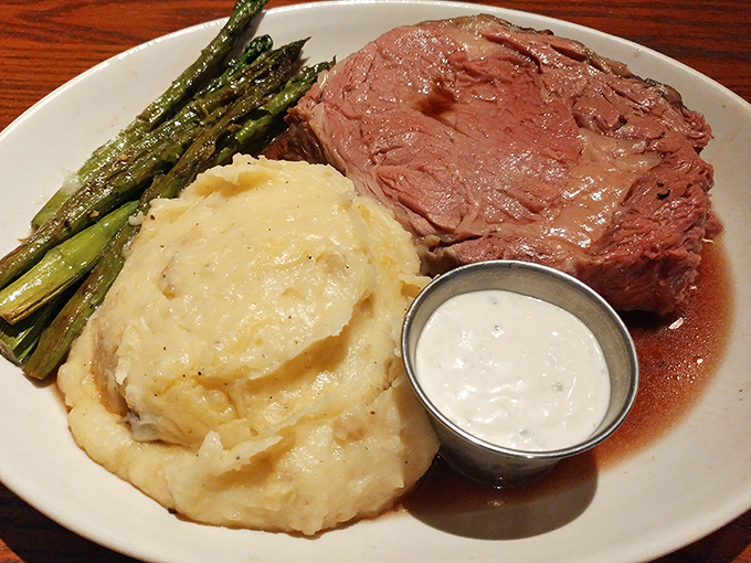 Prime rib so perfectly cooked it practically melts on contact, accompanied by cloud-like mashed potatoes that could make a grown adult weep with joy.