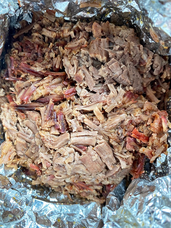 Pulled pork that surrendered to smoke and time. This isn't just meat&mdash;it's a tender confession wrapped in aluminum foil.