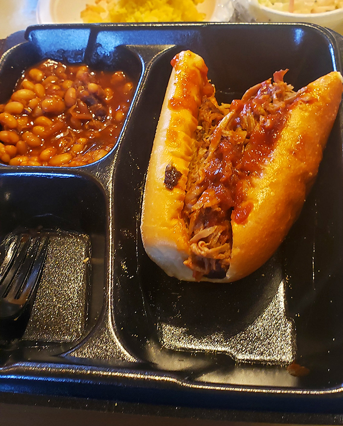 A pulled pork sandwich and baked beans&mdash;the kind of lunch that requires both a napkin and a nap afterward. Worth every yawn.