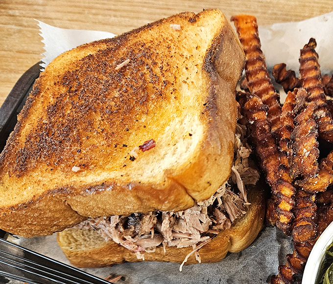 This pulled pork sandwich with crinkle-cut fries isn't trying to reinvent the wheel, just perfect it.
