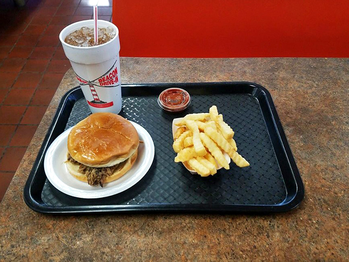 Simple pleasures: a pulled pork sandwich, crispy fries, and sweet tea in a cup big enough to baptize a small child.