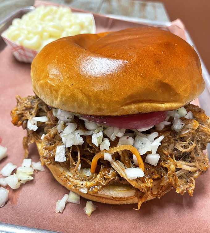 A proper pulled pork sandwich should require both hands and several napkins. This glorious mess of tender meat, tangy sauce, and crunchy slaw delivers on all counts.