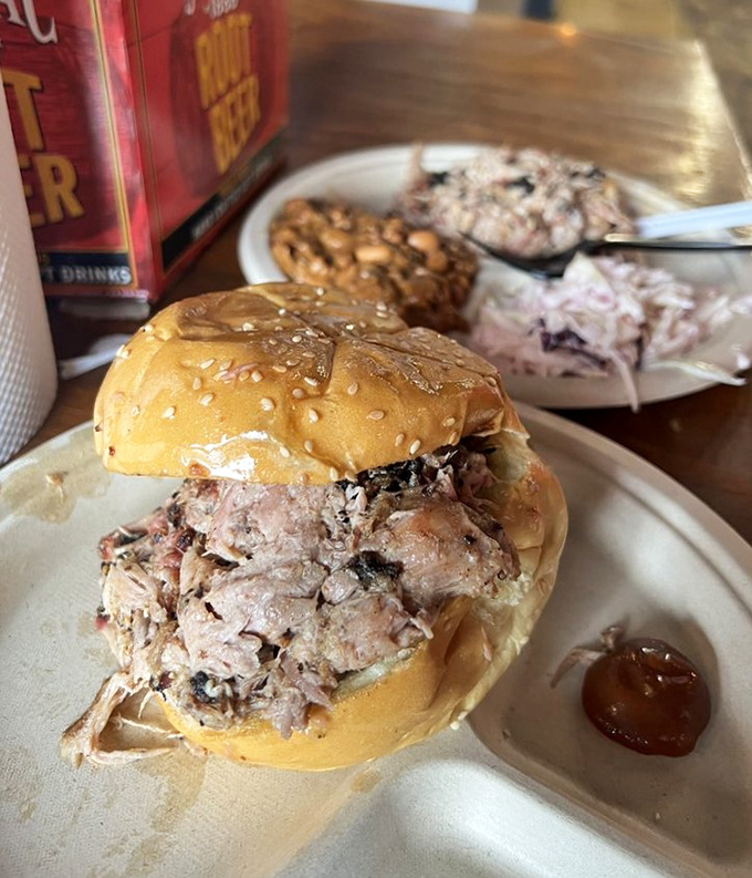 Pulled pork that actually maintains its dignity. No mushy, sauce-drowned mess here&mdash;just perfectly smoked strands cradled in a simple bun.