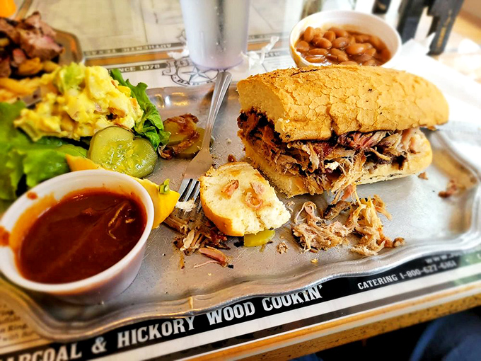 The pulled pork sandwich &ndash; where shredded smoky goodness finds its soulmate in a soft bun. That pickle chip is the perfect chaperone.