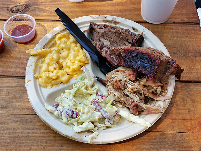 The holy trinity of barbecue: pulled pork, creamy mac and cheese, and coleslaw that actually deserves plate space. A balanced diet in Erie.