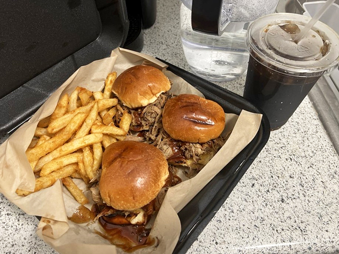 Three perfect pulled pork sliders that'll make you question why you ever ordered just one of anything here.