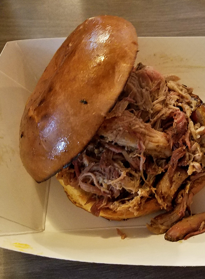 That pulled pork sandwich isn't messing around – it's the kind that requires both hands and several napkins standing by.