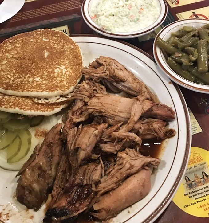 Pulled pork with all the fixings &ndash; tender strands of smoky goodness alongside pancakes and green beans. Kentucky's version of a balanced diet!