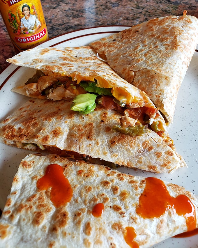 When a quesadilla meets breakfast ingredients, magic happens. That hot sauce isn't just decoration&mdash;it's essential punctuation.