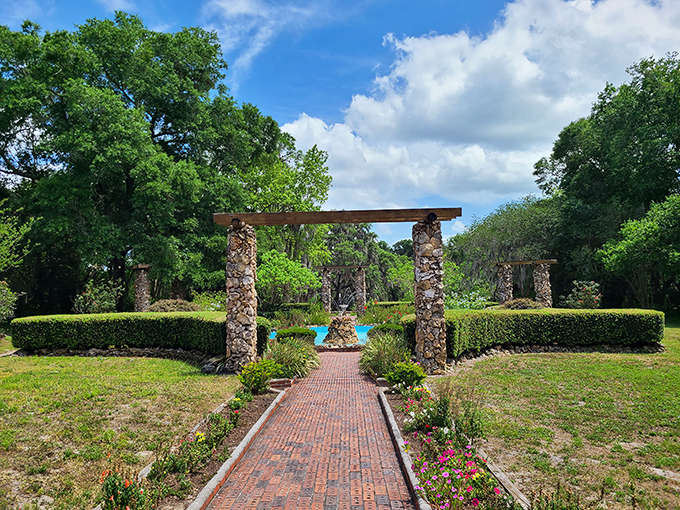 Stone columns and manicured hedges at Ravine Gardens create a scene straight out of a Southern gothic novel, minus the family secrets.