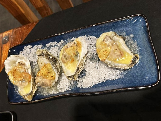 Fresh oysters on a cobalt blue plate&mdash;ocean treasures presented like jewelry, just waiting for a squeeze of lemon.