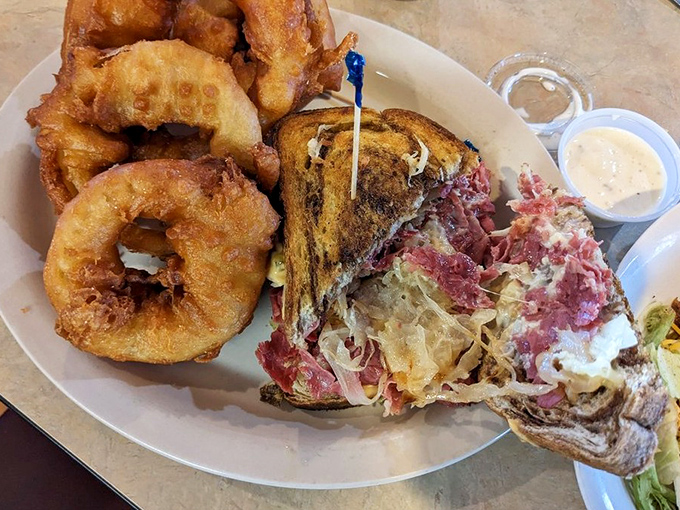A Reuben sandwich that doesn't skimp on the good stuff, paired with onion rings the size of bracelets. Napkins required, diet resolutions forgotten.