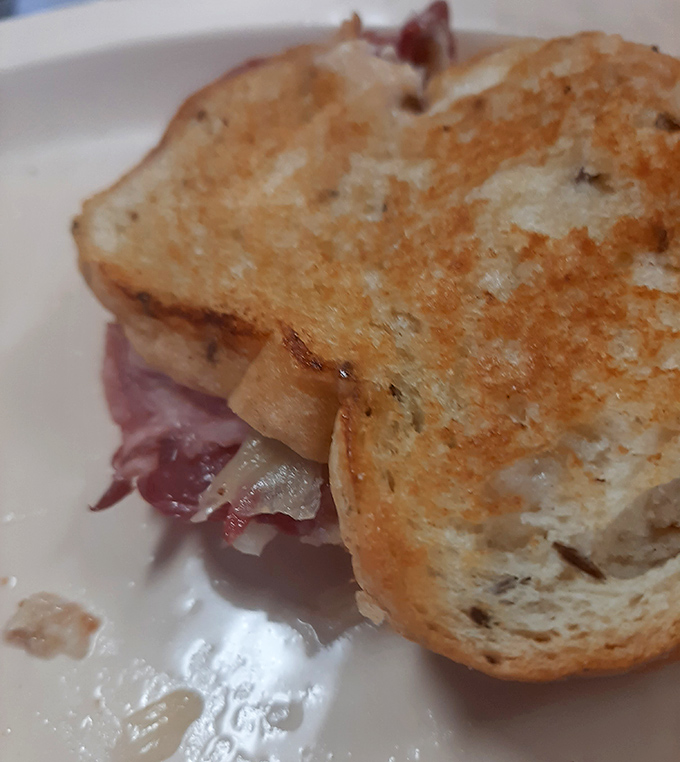 This isn't just a sandwich; it's a Reuben revelation &ndash; grilled to golden perfection with the ideal meat-to-sauerkraut ratio that makes every bite harmonious.