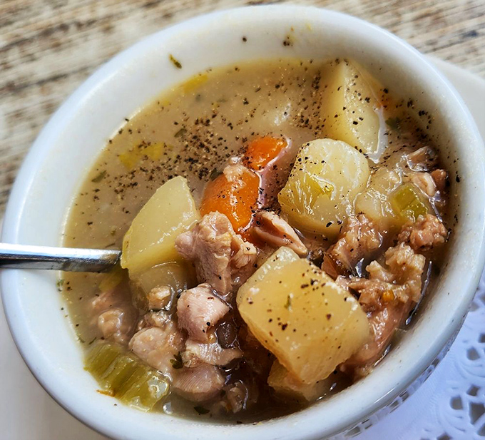 This isn't just soup—it's Rhode Island clam chowder with chunks of clams and potatoes swimming in broth that warms the soul.