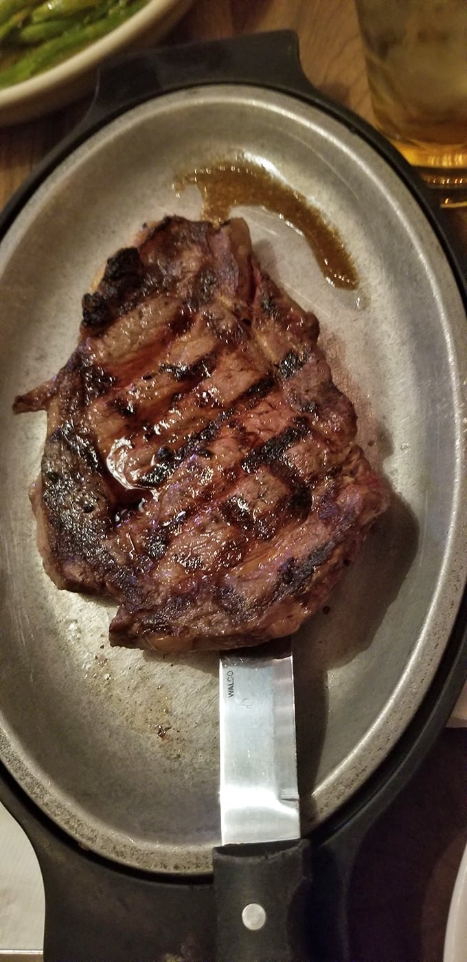 Behold the ribeye&mdash;a carnivore's dream on a sizzling platter. Those grill marks aren't just decoration; they're a roadmap to flavor town.