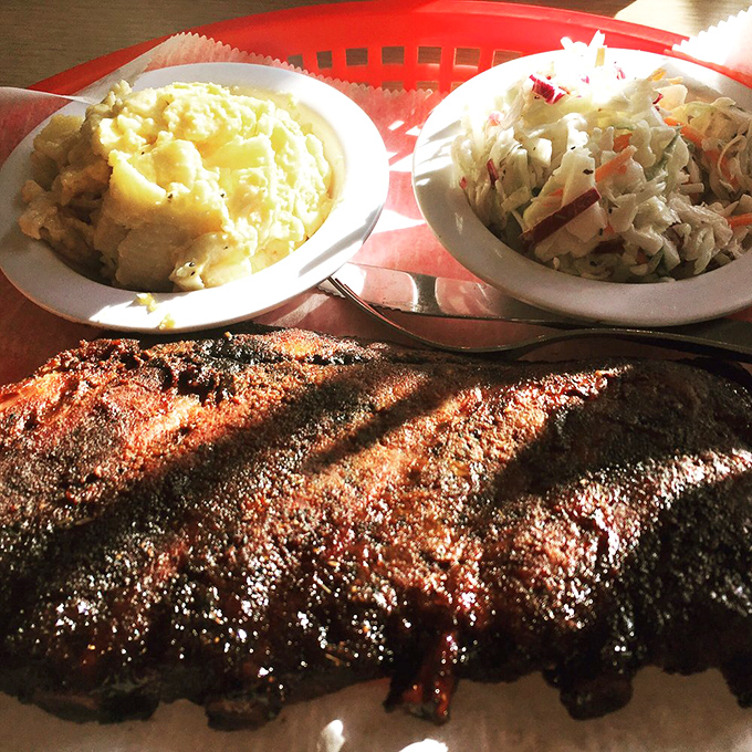 Behold the holy trinity of barbecue bliss: perfectly crusted ribs, creamy mac and cheese, and coleslaw that actually deserves space on your plate.