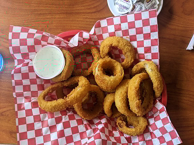 Onion rings that don't just accompany a meal but deserve their own spotlight. Crispy, golden halos that make you wonder why we don't wear them as crowns.