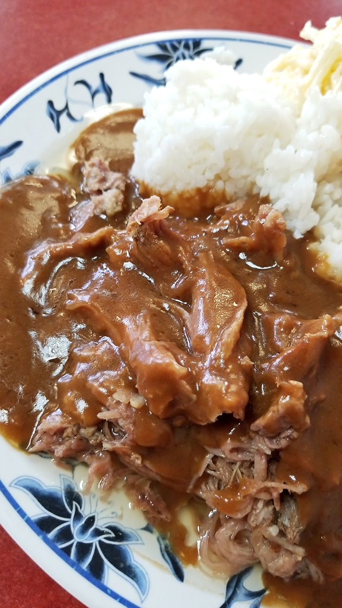 The curry gravy cascading over tender meat is like a warm hug from your favorite auntie&mdash;comforting, generous, and slightly bossy.