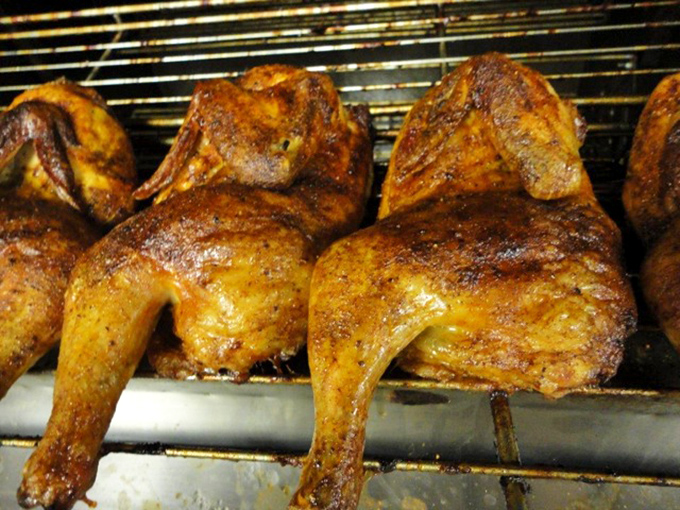 These smoked chicken quarters have achieved that golden-mahogany hue that whispers sweet nothings to your taste buds before you take the first bite.