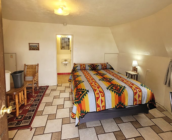 Southwestern patterns and sloping walls create a surprisingly cozy interior. No smoke signals required to call the front desk.