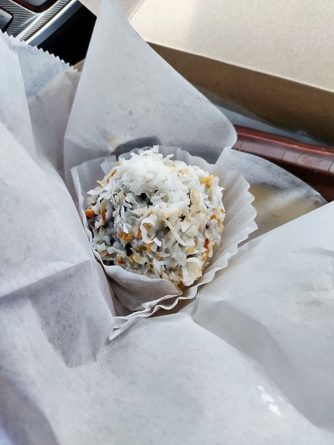 This coconut-dusted rum ball isn't just dessert; it's edible proof that good things come in small packages.
