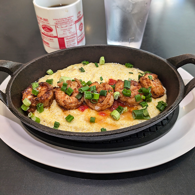 Seafood grits with plump shrimp that practically snap when you bite them. Florida's coastal bounty meets Southern comfort in one cast-iron skillet.