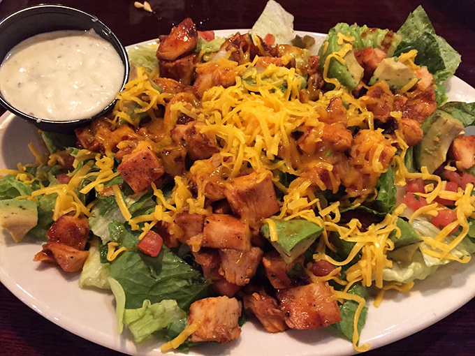 A salad that doesn't apologize for being healthy because it's wearing a barbecue disguise. Cheese and smoked meat make vegetables worth eating.