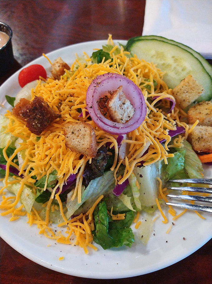 This isn't just a salad; it's a colorful rebellion against boring greens. Those crispy croutons and shredded cheese turn a healthy choice into a celebration.