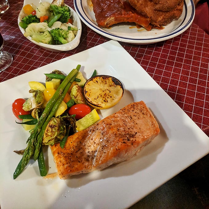 Even salmon gets the royal treatment here, perfectly cooked and surrounded by vegetables that didn't come from a freezer bag