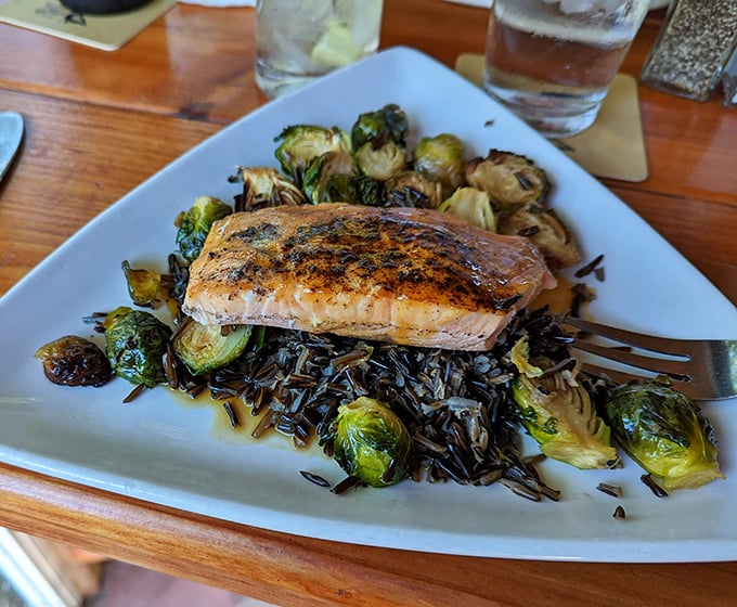 Salmon that looks like it jumped from the river to the grill to your plate, nestled on a bed of wild rice that screams "Minnesota!" with every nutty bite.