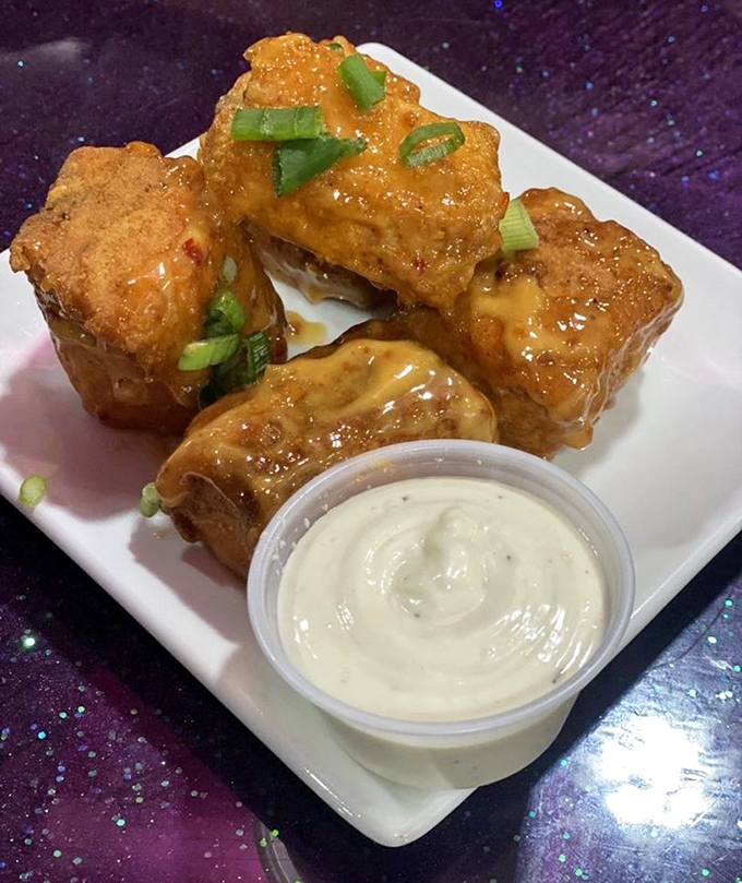 Golden salmon bites with a side of creamy sauce&mdash;proof that sometimes the best treasures come in small, perfectly fried packages.