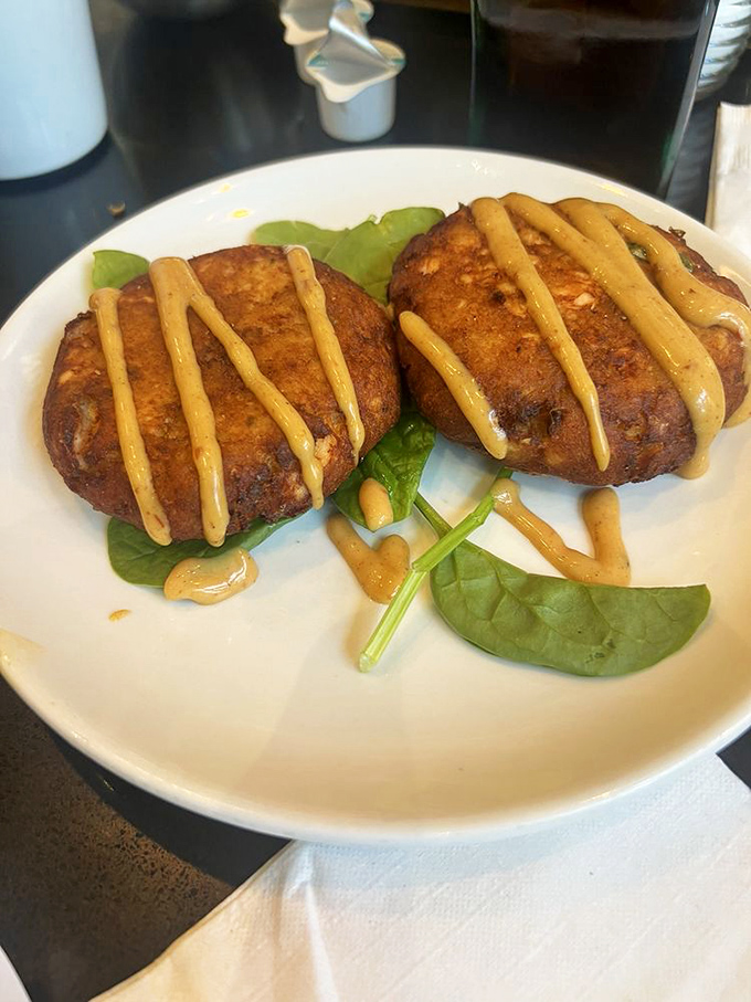 These salmon croquettes swagger with confidence, drizzled in sauce and served with a side of "I'll-be-back-tomorrow."