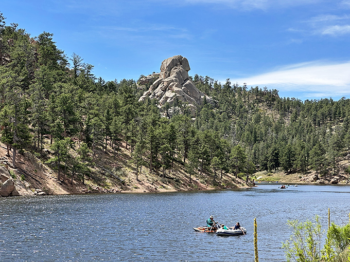 This granite peak watches over kayakers like a benevolent giant who's really into water sports.