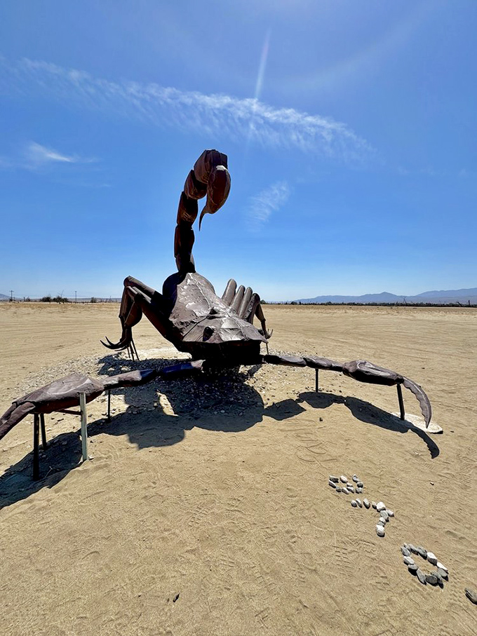 The scorpion's tail curves menacingly skyward, a rusty reminder that art in the desert can be both beautiful and slightly terrifying.