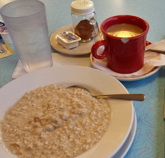 Oatmeal: the breakfast that says "I'm being responsible" while secretly being delicious. That red coffee mug promises the perfect pairing.