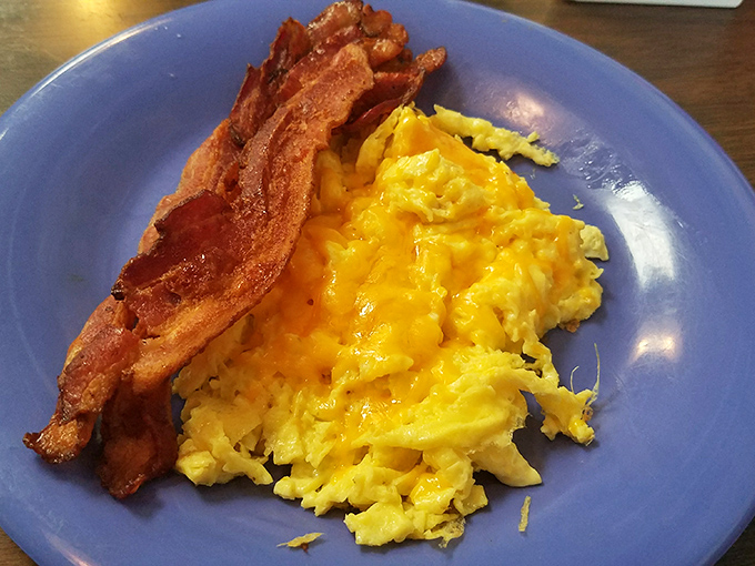 Scrambled eggs and bacon: breakfast's perfect power couple. Simple, unpretentious, and executed with the kind of care that turns the ordinary into the extraordinary.
