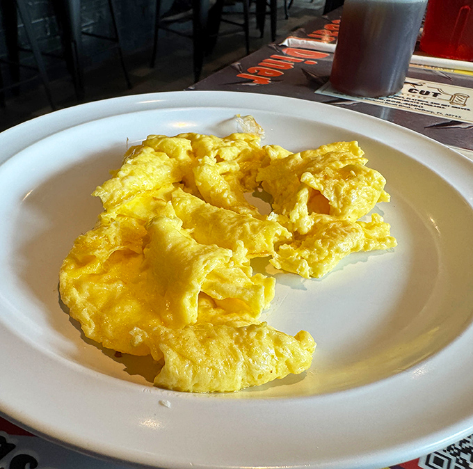 Scrambled eggs that actually look like someone cared while making them. Fluffy, bright, and ready to turn your morning from mundane to magnificent.