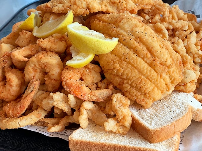 A seafood platter that would make Neptune himself jealous. The golden-fried perfection and those lemon wedges are like sunshine on a plate.