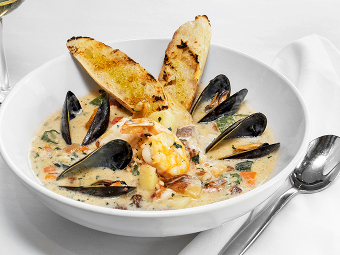This seafood chowder isn't just a soup; it's a maritime gathering where each shellfish brings its own story to the creamy celebration.