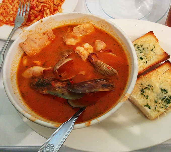 Cioppino: where tomatoes, seafood, and garlic hold their annual summit meeting. The shellfish clearly voted to dive right in.