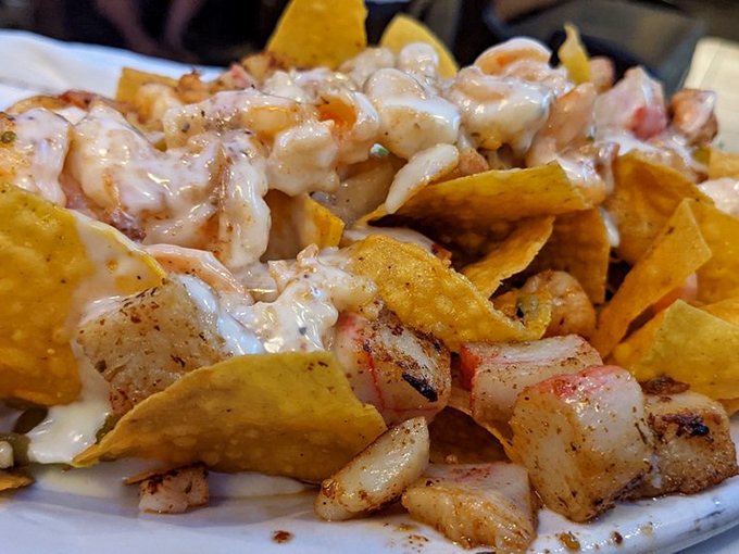 Seafood nachos that brilliantly answer the question nobody thought to ask: "What happens when the ocean meets Mexico on a plate?"