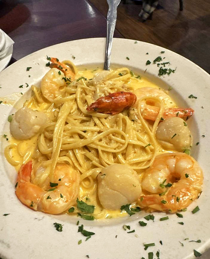 Seafood linguine that's practically singing opera! Plump shrimp and scallops nestled in pasta so perfectly cooked it should win a James Beard Award.