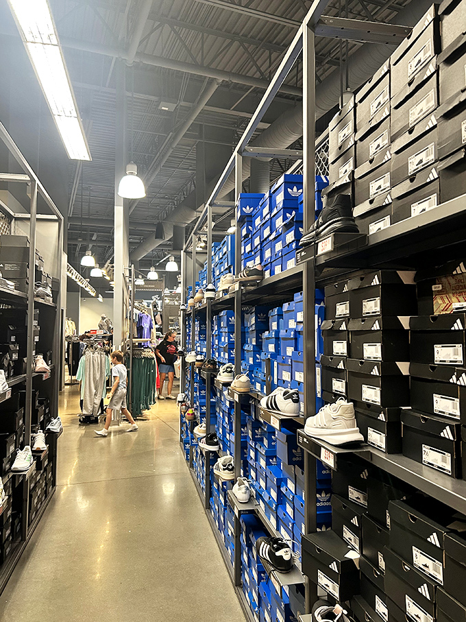 The Adidas outlet, where the wall of blue boxes contains enough athletic potential to make you believe you might actually use that gym membership.