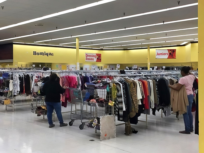 The "Boutique" and "Dressing Room" signs guide shoppers through this labyrinth of labels, where patience rewards the persistent treasure hunter.