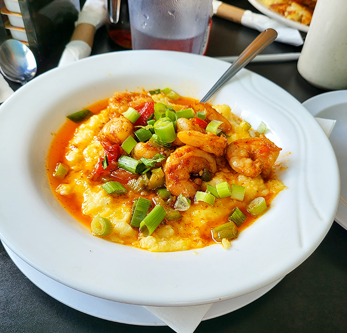 Southern comfort meets Ohio hospitality. These shrimp and grits with vibrant scallions would make Charleston natives book a flight north.